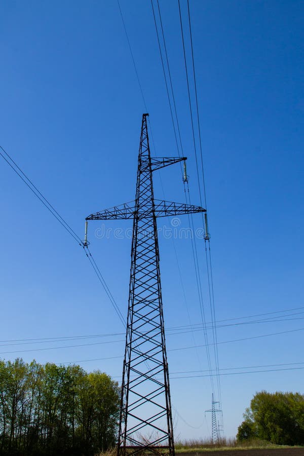 High Voltage Power Line Against Blue Sky Stock Image - Image of cable ...