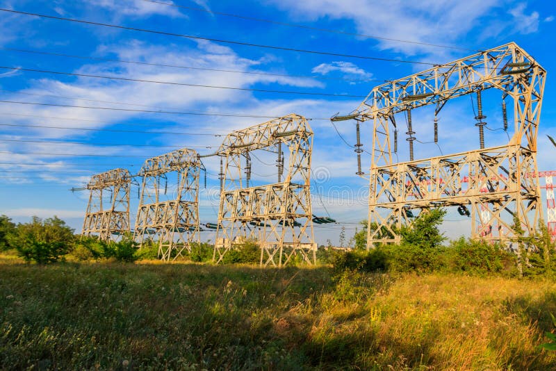 High Voltage Power Line Against Blue Sky Stock Photo - Image of energy ...