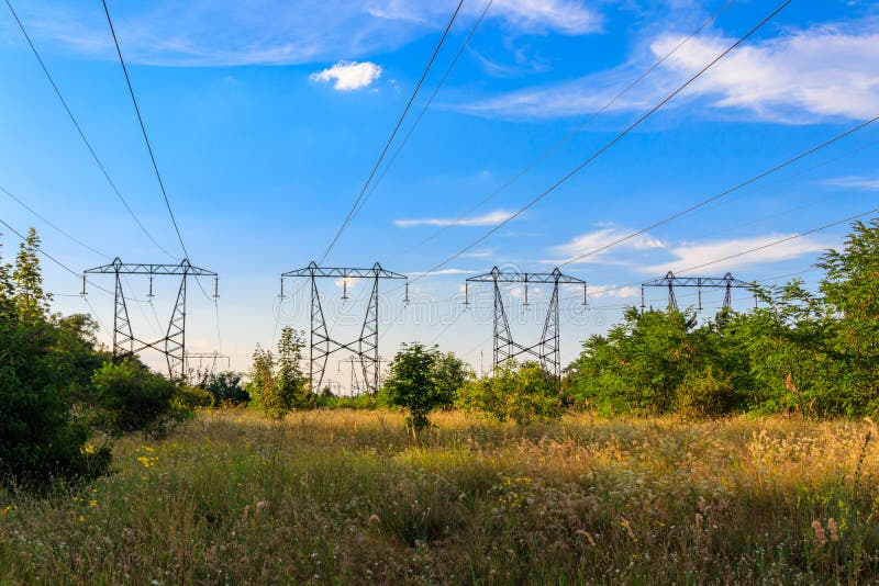 High Voltage Power Line Against Blue Sky Stock Image - Image of ...