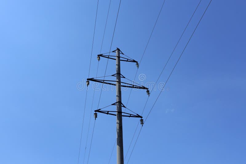 High Voltage Power Line Against the Blue Sky Stock Photo - Image of ...