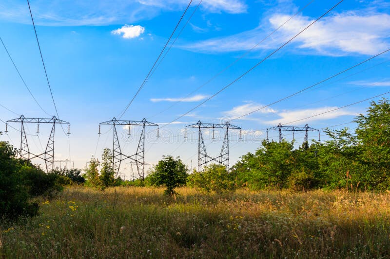 High Voltage Power Line Against Blue Sky Stock Photo - Image of ...