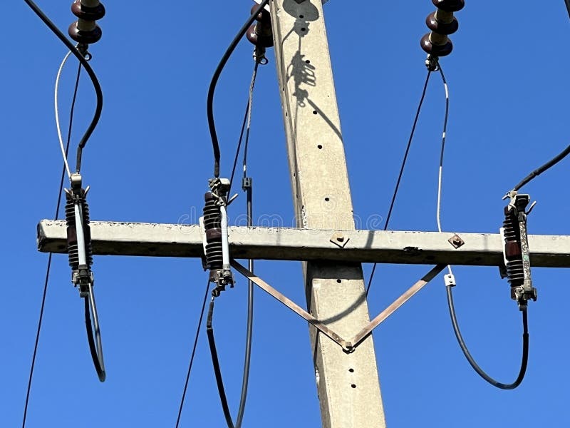 High Voltage Power Line on a Clear Blue Sky. High - Voltage Line Stock ...