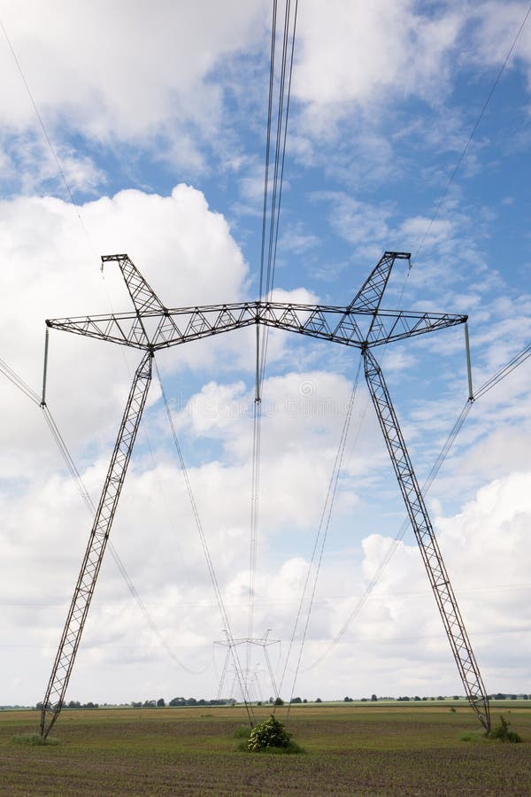 High Voltage Power Line in a Field, Close-up Stock Photo - Image of ...