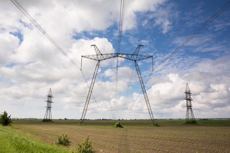 High Voltage Power Line in a Field Stock Image - Image of supply, green ...