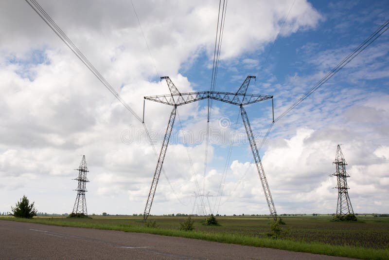High Voltage Power Line in a Field Stock Photo - Image of field ...