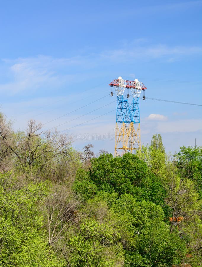 High Voltage Power Line. Great Height Above the Trees. Spring Sky Stock ...