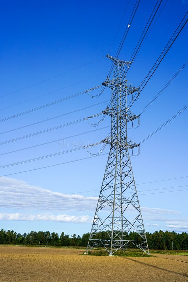 High Voltage Power Line Metal Support on a Blue Sky Background Stock ...