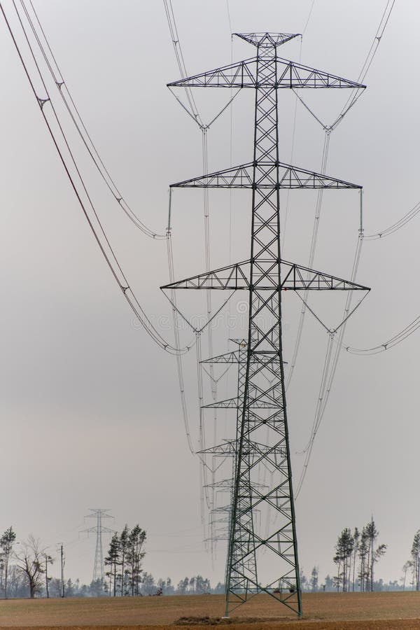 High Voltage Power Line. Overhead Electrical Cables Routed Throu Stock ...