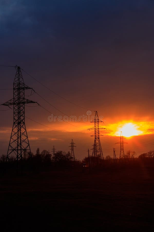 High Voltage Power Line at Sunset Stock Photo - Image of engineering ...