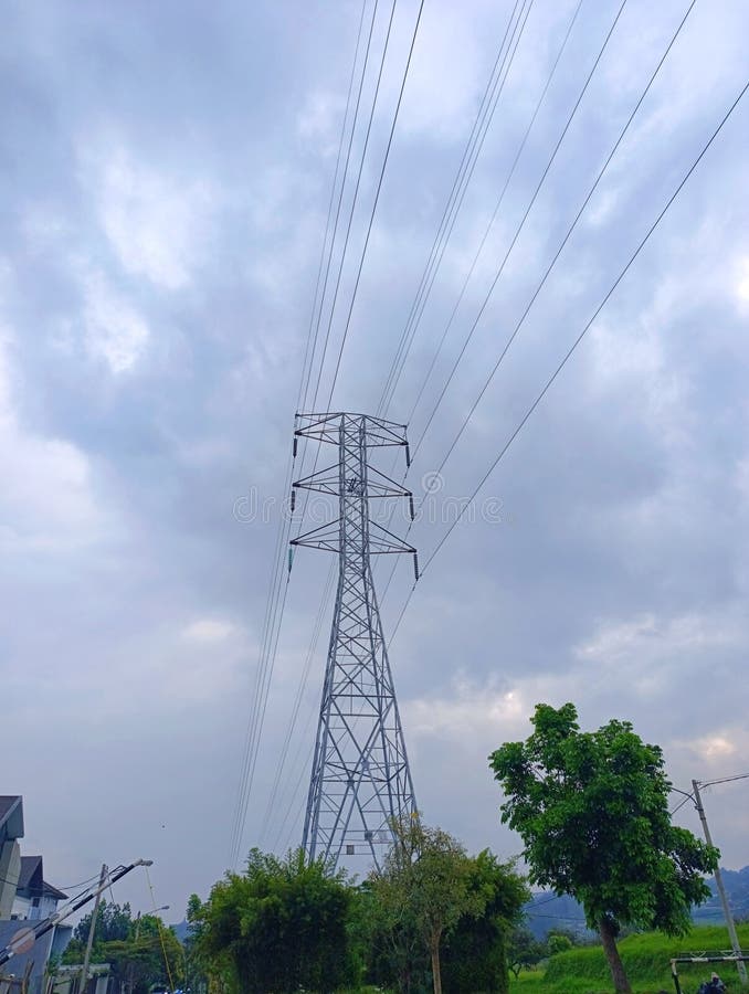High Voltage Power Line Tower with Beautiful Cloudy Sky Background ...