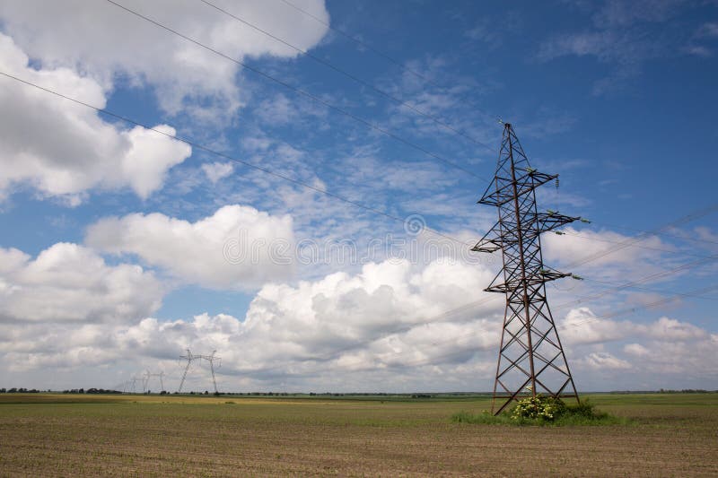High-voltage Power Line Tower in the Field Stock Image - Image of line ...
