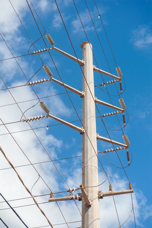 High-voltage Power Lines on Blue Sky Background Leading Out To ...