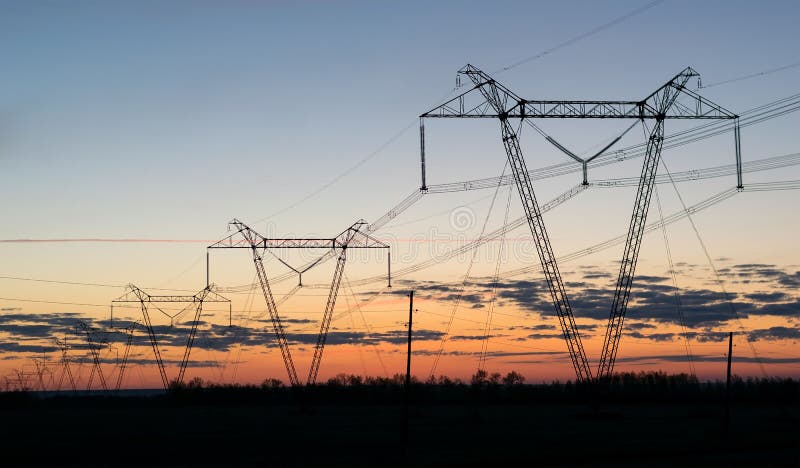High Voltage Power Lines at Dusk at Sunset Stock Photo - Image of cable ...