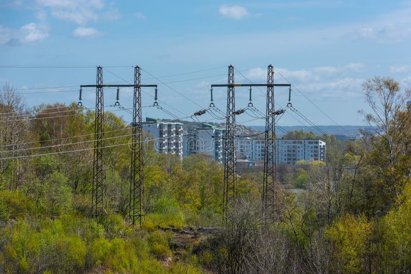 High Voltage Power Lines Going through a Park Outside a City.. Stock ...