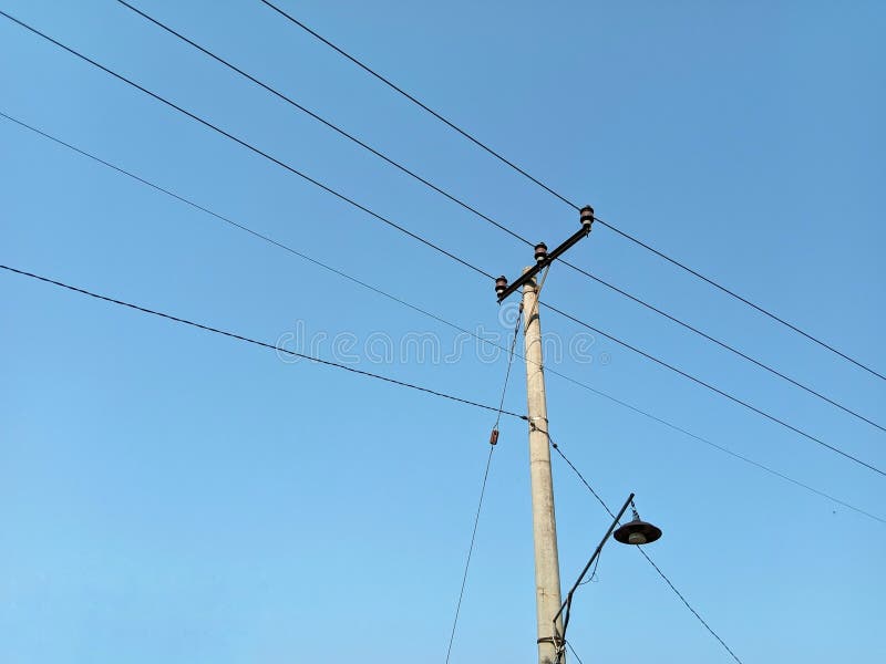 High Voltage Power Lines with Low Angle Shots of Objects Stock Image ...