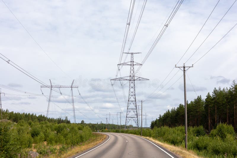 Power lines over a road stock photo. Image of cable - 225235546