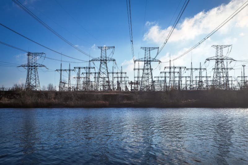 High-voltage Power Lines on the Shore of Lake. Stock Image - Image of ...