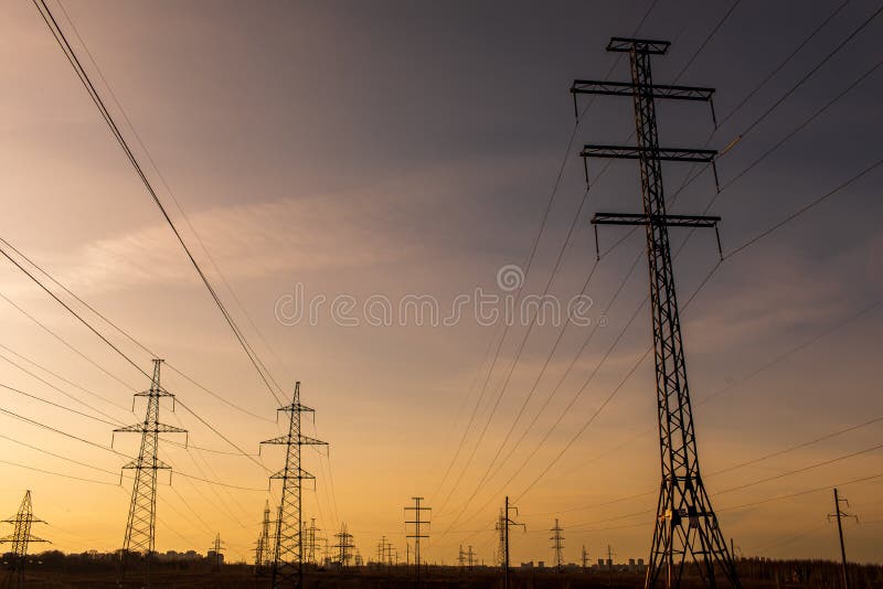 High-voltage Power Lines at Sunset. Electricity Distribution Station ...