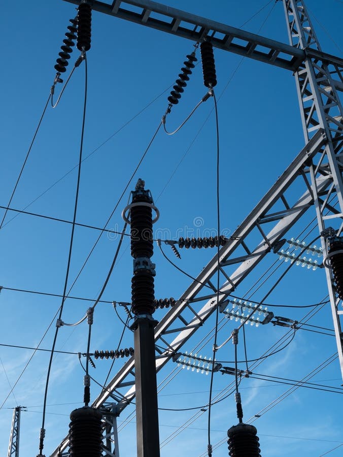 High-voltage Power Lines of Transformer Substation Against the Blue Sky ...
