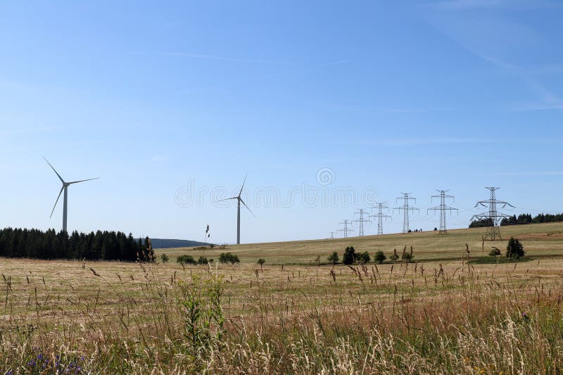 High Voltage Power Lines and Wind Power Plant Stock Photo - Image of ...