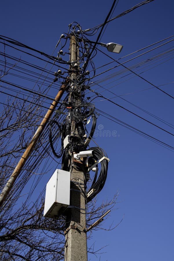 High Voltage Power Pole with Wires Tangled Stock Image - Image of ...