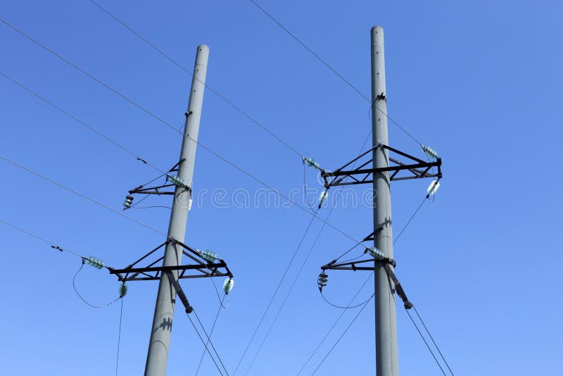 High Voltage Power Pylons Against the Blue Sky Stock Image - Image of ...