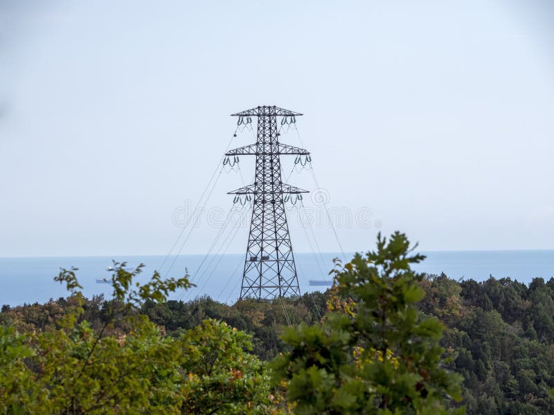 High Voltage Power Pylons Against Blue Sky Stock Image - Image of tower ...