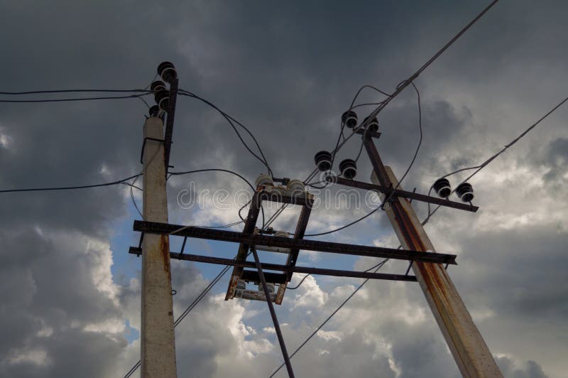 Mast of a High-voltage Power Line Against the Cloudy Sky Stock Photo ...