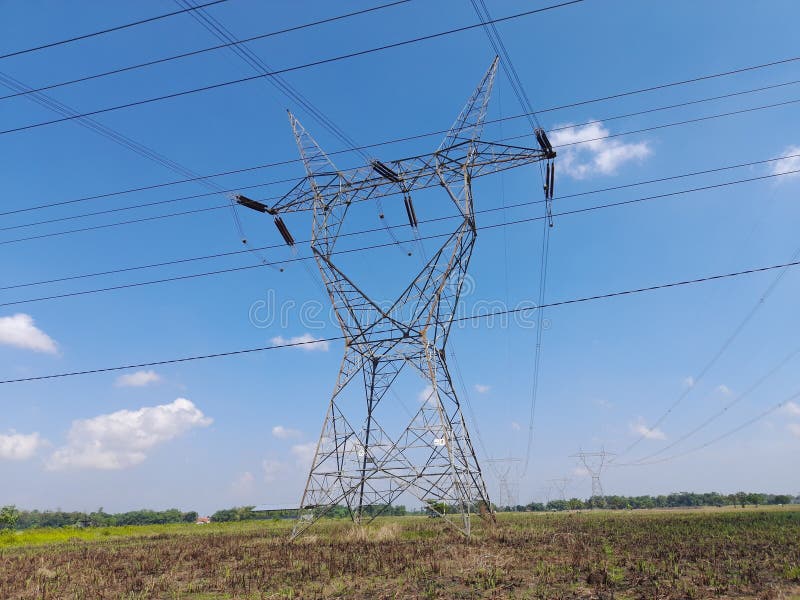 High Voltage Power Tower with Blue Sky Background Stock Photo - Image ...