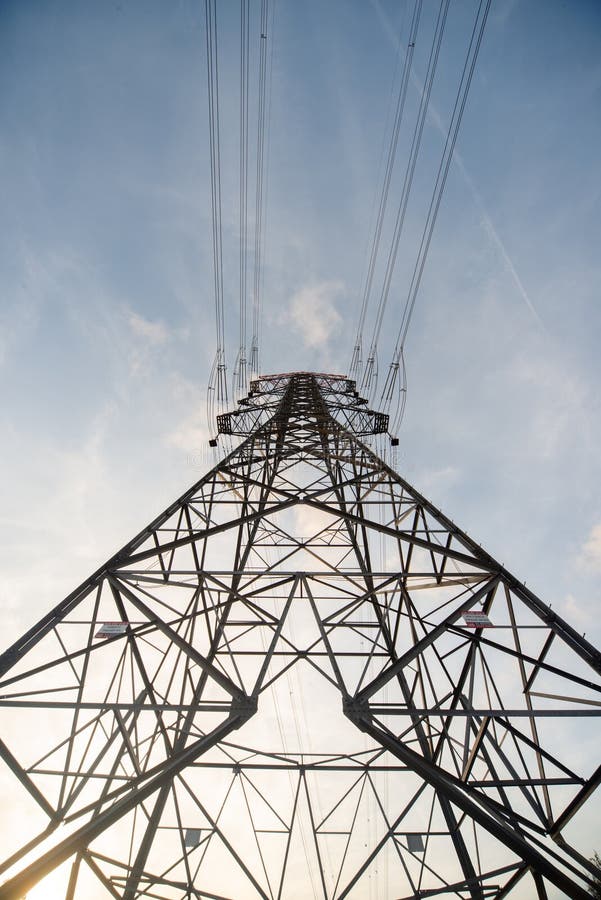 High-Voltage Power Tower from Ground Perspective Stock Photo - Image of ...