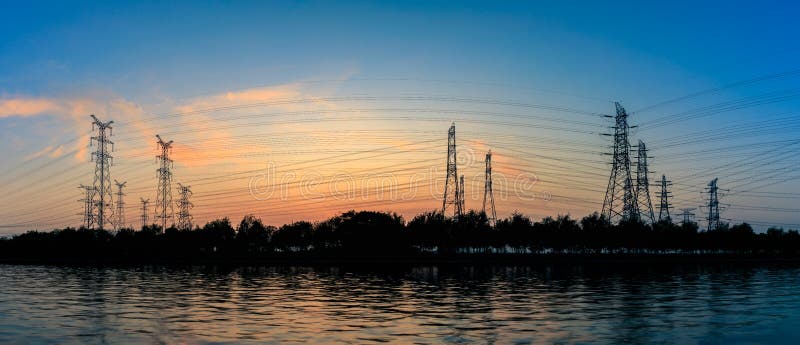 High Voltage Power Tower and Nature Landscape at Sunset Stock Photo ...