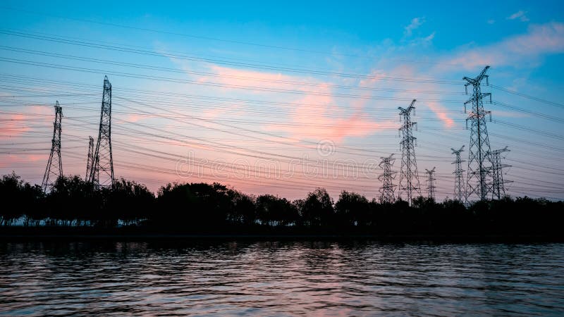 High Voltage Power Tower and Nature Landscape at Sunset Stock Photo ...
