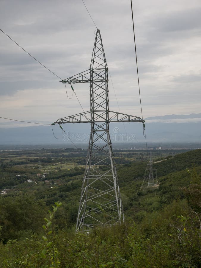 High-voltage Power Transmission Towers Over Farm Fields Stock Image ...