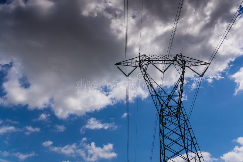 High voltage pylon stock photo. Image of clouds, gray - 161087714