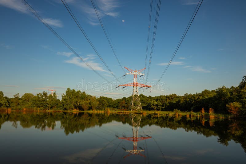 High Voltage Pylons in a Nature Reserve, Pillars Above the Water Stock ...