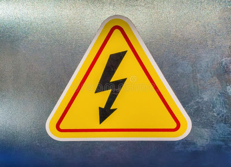 High Voltage Sign in the Form of a Lightning Bolt on a Yellow Triangle ...