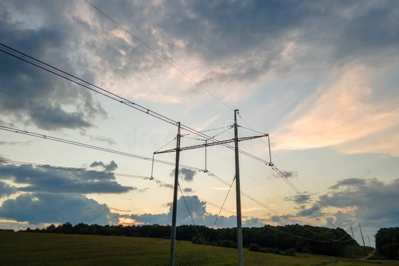High Voltage Tower with Electric Power Lines at Sunset Stock Photo ...