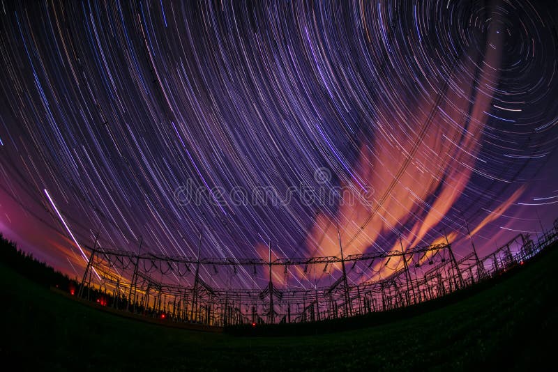 High-voltage Towers and Stellar Trajectories Stock Image - Image of ...