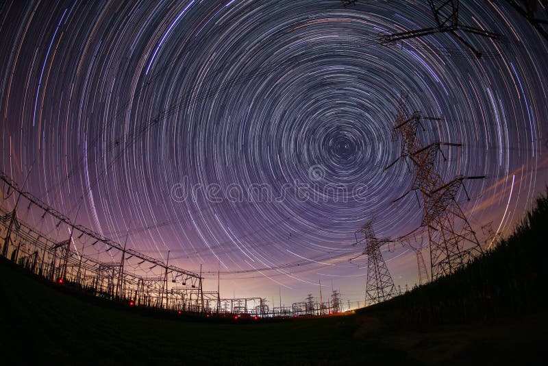 High-voltage Towers and Stellar Trajectories Stock Image - Image of ...