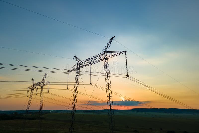 High Voltage Towers with Electric Power Lines at Sunset Stock Image ...