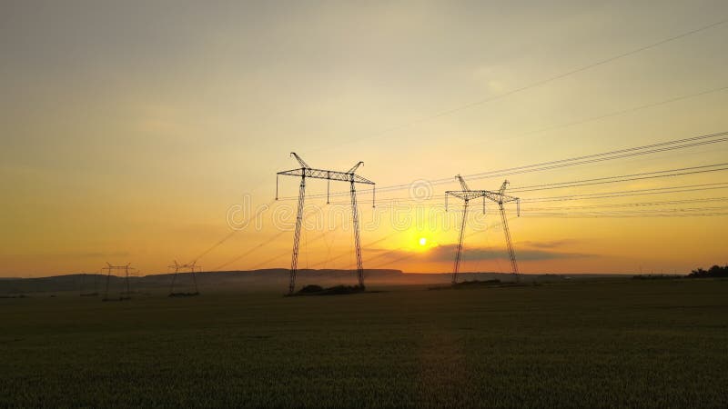 High Voltage Towers with Electric Power Lines at Sunset Stock Video ...