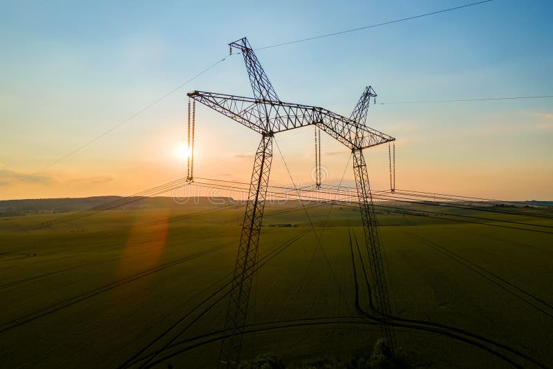 High Voltage Towers with Electric Power Lines at Sunset Stock Image ...