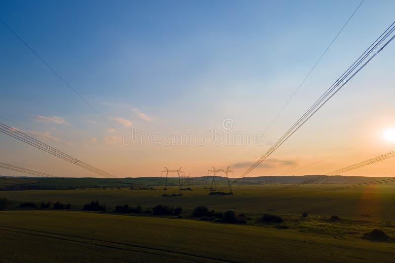 High Voltage Towers with Electric Power Lines at Sunset Stock Image ...