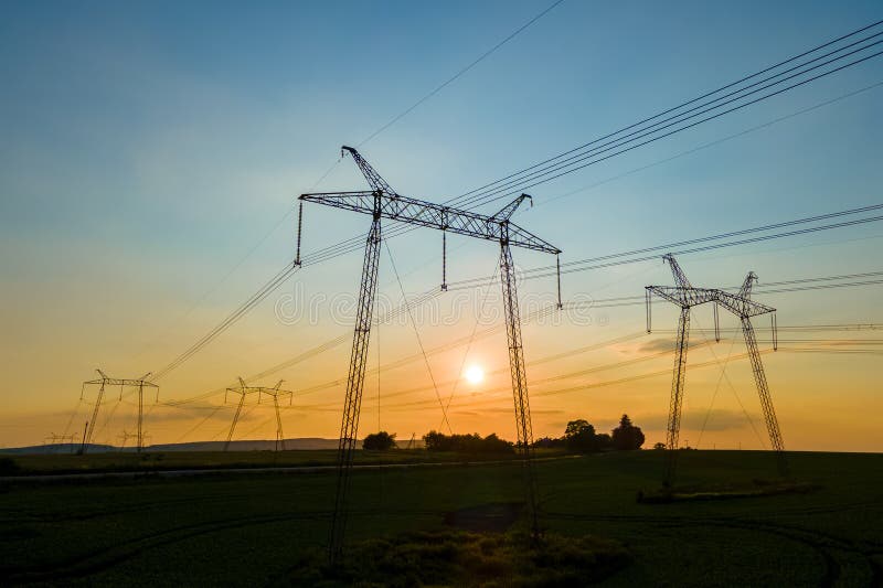 High Voltage Towers with Electric Power Lines at Sunset Stock Image ...