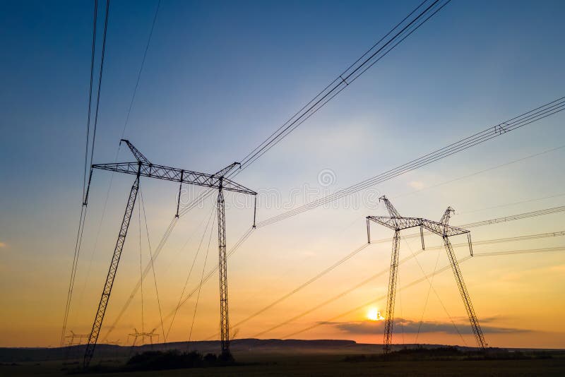 High Voltage Towers with Electric Power Lines at Sunset Stock Image ...