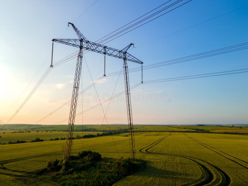 High Voltage Towers with Electric Power Lines at Sunset Stock Image ...