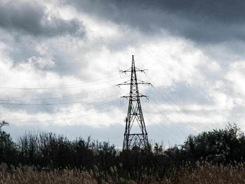 High Voltage Towers on Skies Background. Transmission Line Tower Stock ...