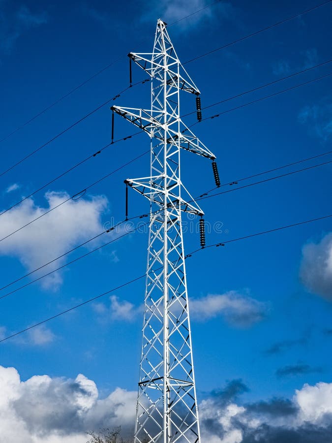 High Voltage Towers on Skies Background. Transmission Line Tower Stock ...
