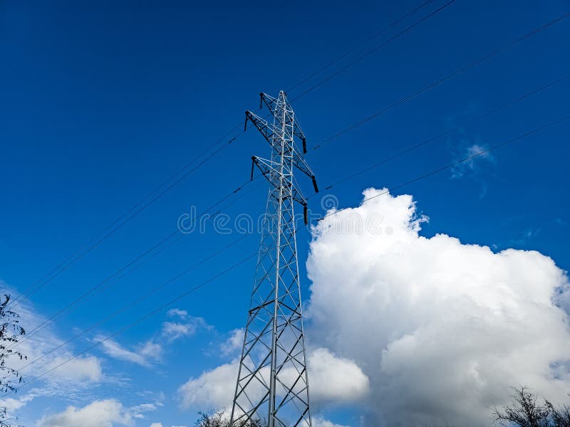 High Voltage Towers on Skies Background. Transmission Line Tower Stock ...