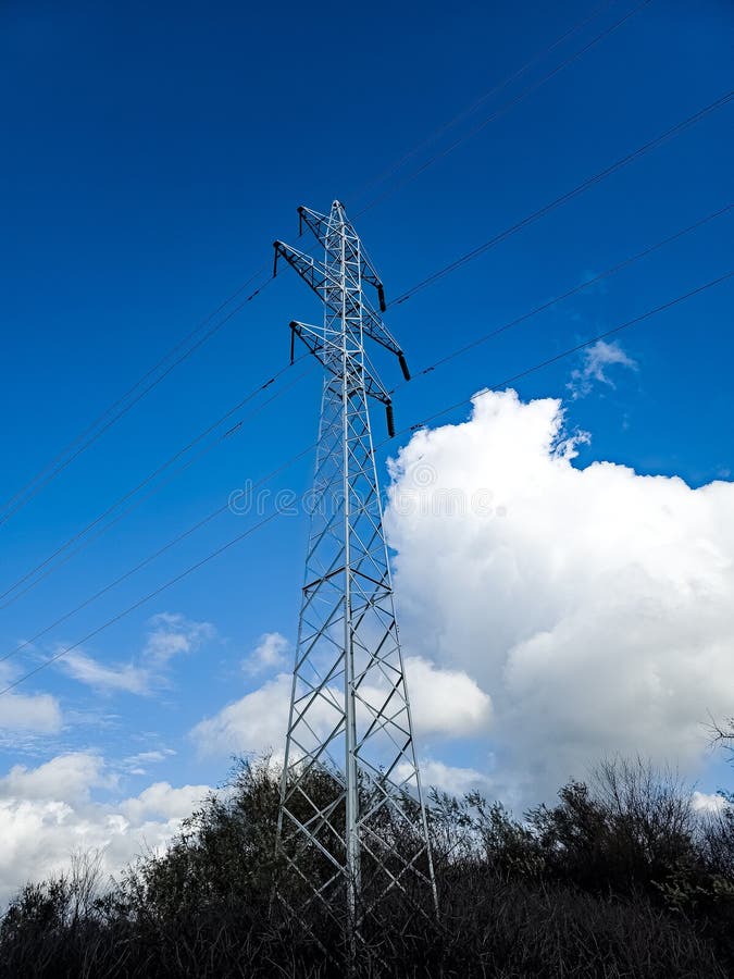 High Voltage Towers on Skies Background. Transmission Line Tower Stock ...